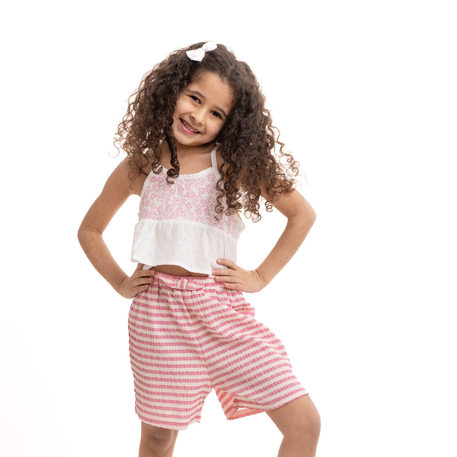 white shoulder laced blouse with fushiya stripped pants